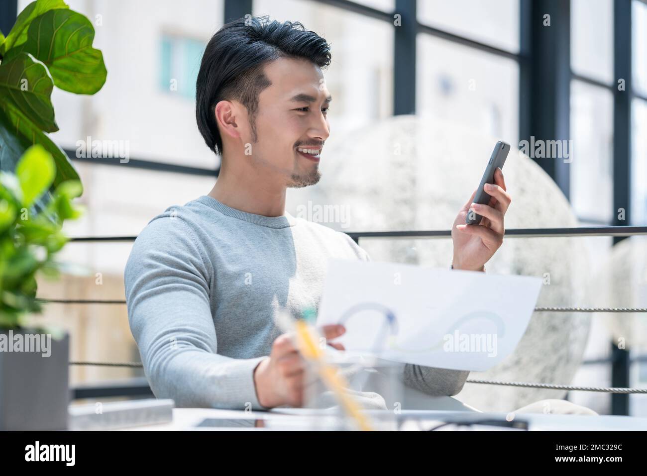 A young business man at work Stock Photo - Alamy