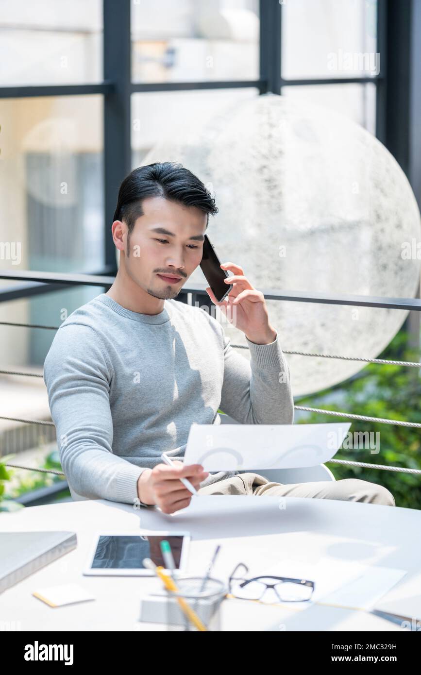 A young business man at work Stock Photo - Alamy