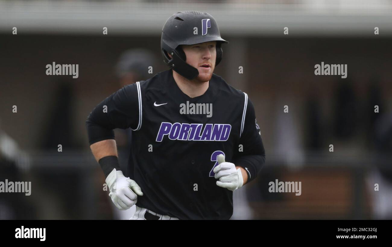 Portland's Sam Brown runs to first base during an NCAA baseball game ...