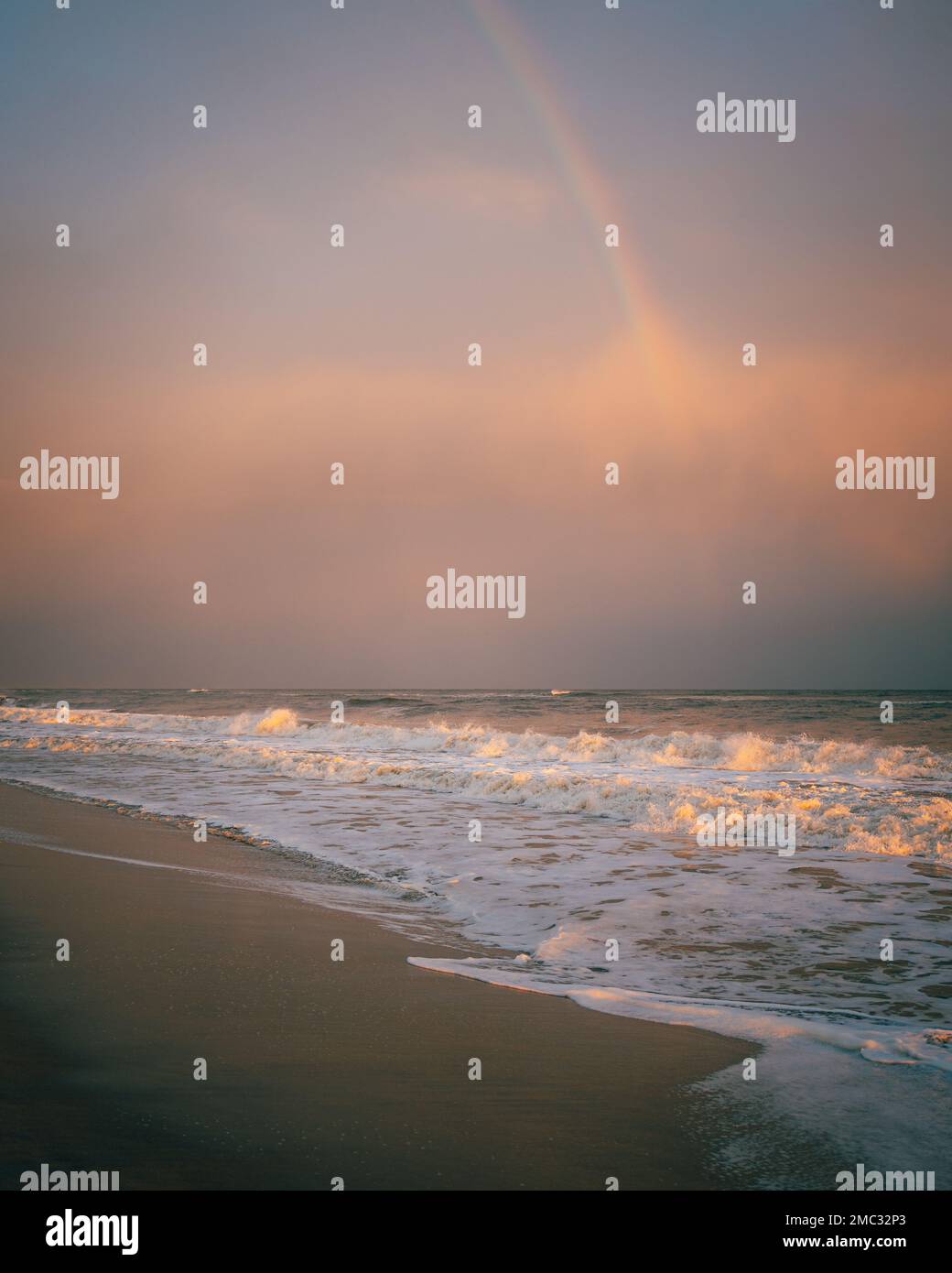 A rainbow at sunset, Cryder Beach, Southampton, New York Stock Photo ...
