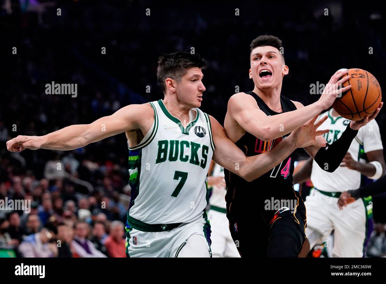 Miami Heat's Tyler Herro drives past Milwaukee Bucks' Grayson Allen ...