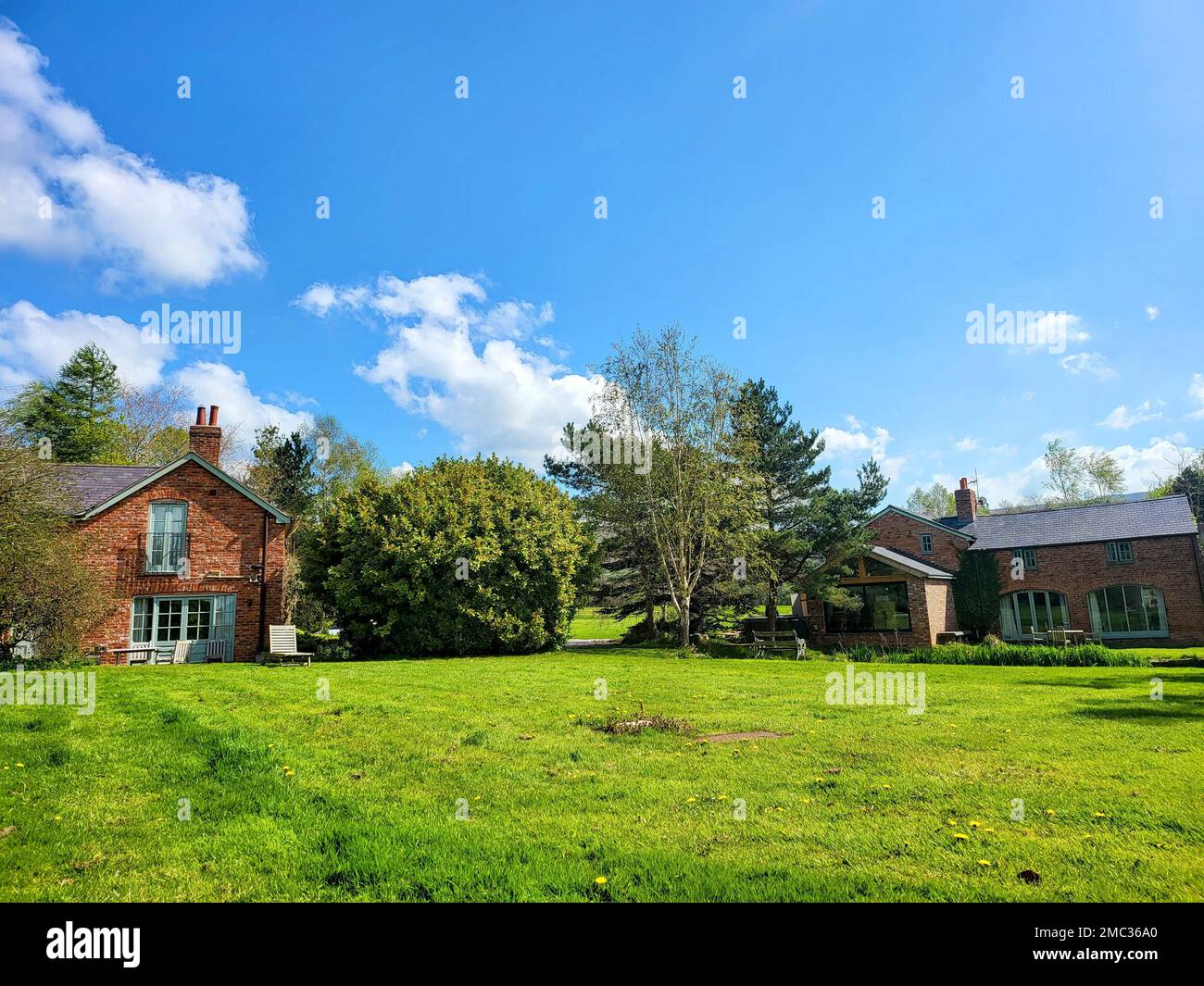 A scenic view of the countryside with brick residential buildings and ...