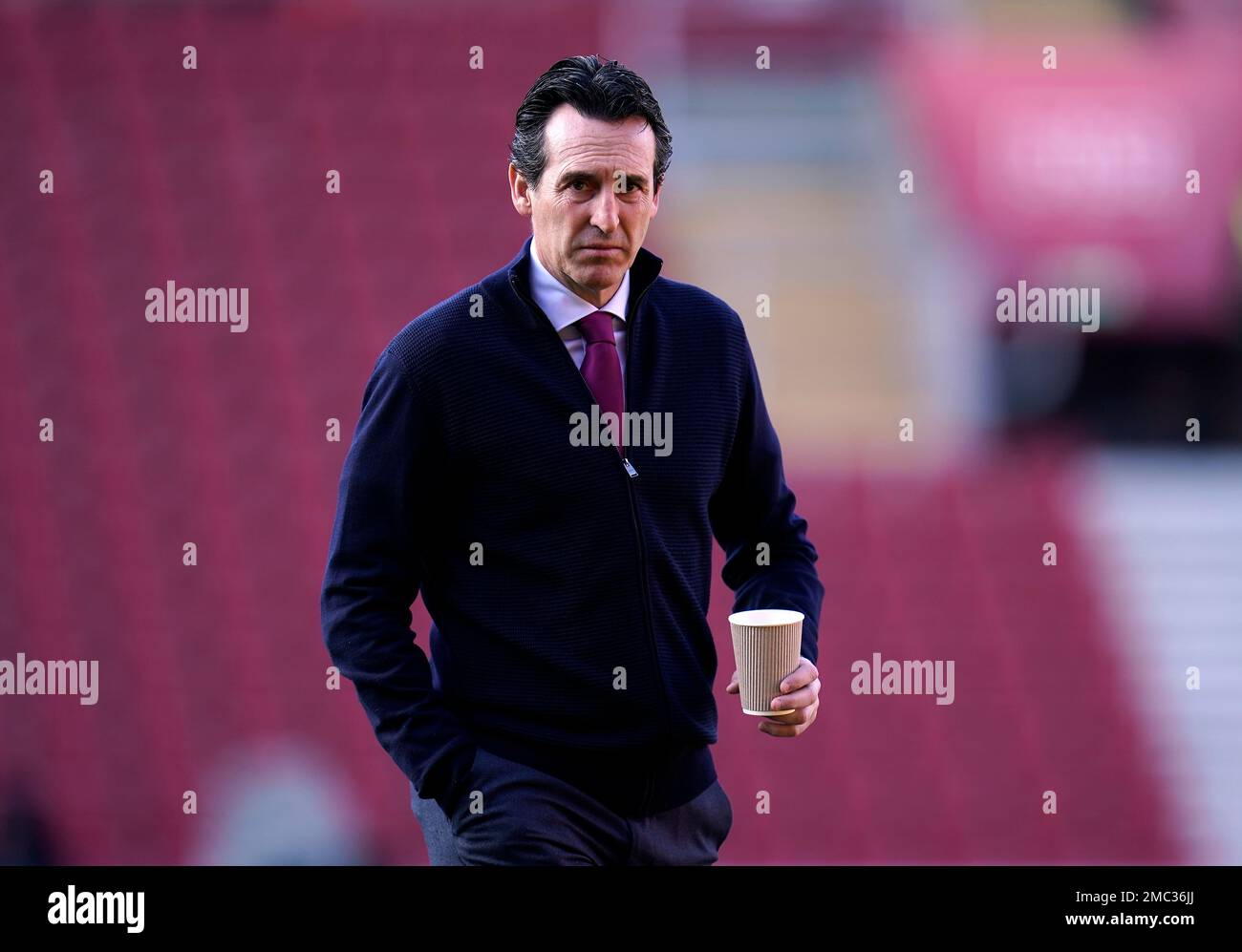 Aston Villa manager Unai Emery inspects the pitch ahead of the Premier ...