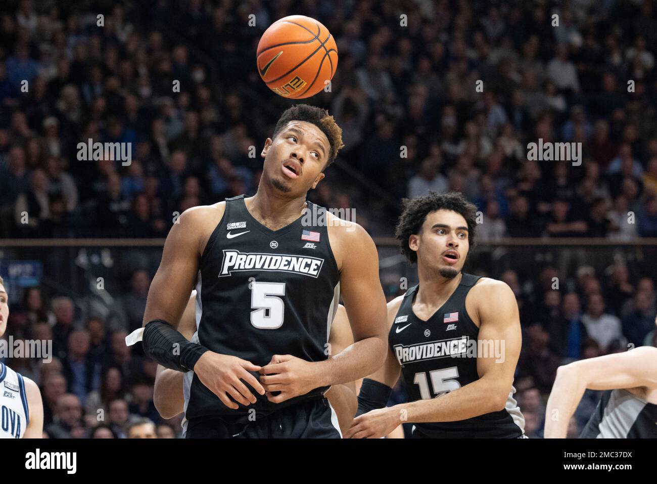 College Basketball Players In Action