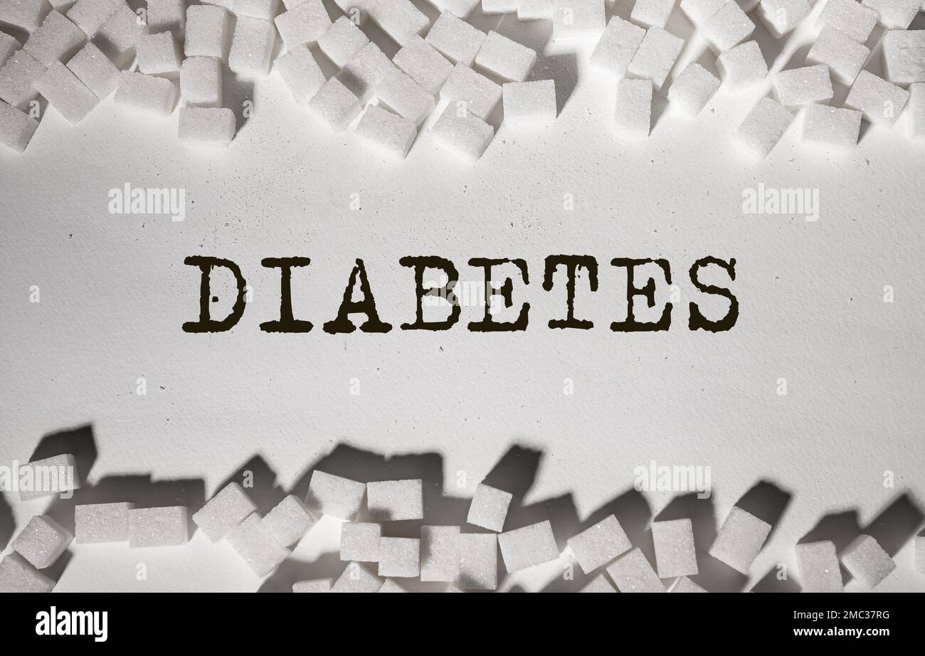 Diabetes word on white background with refined sugar pieces, sweet ...