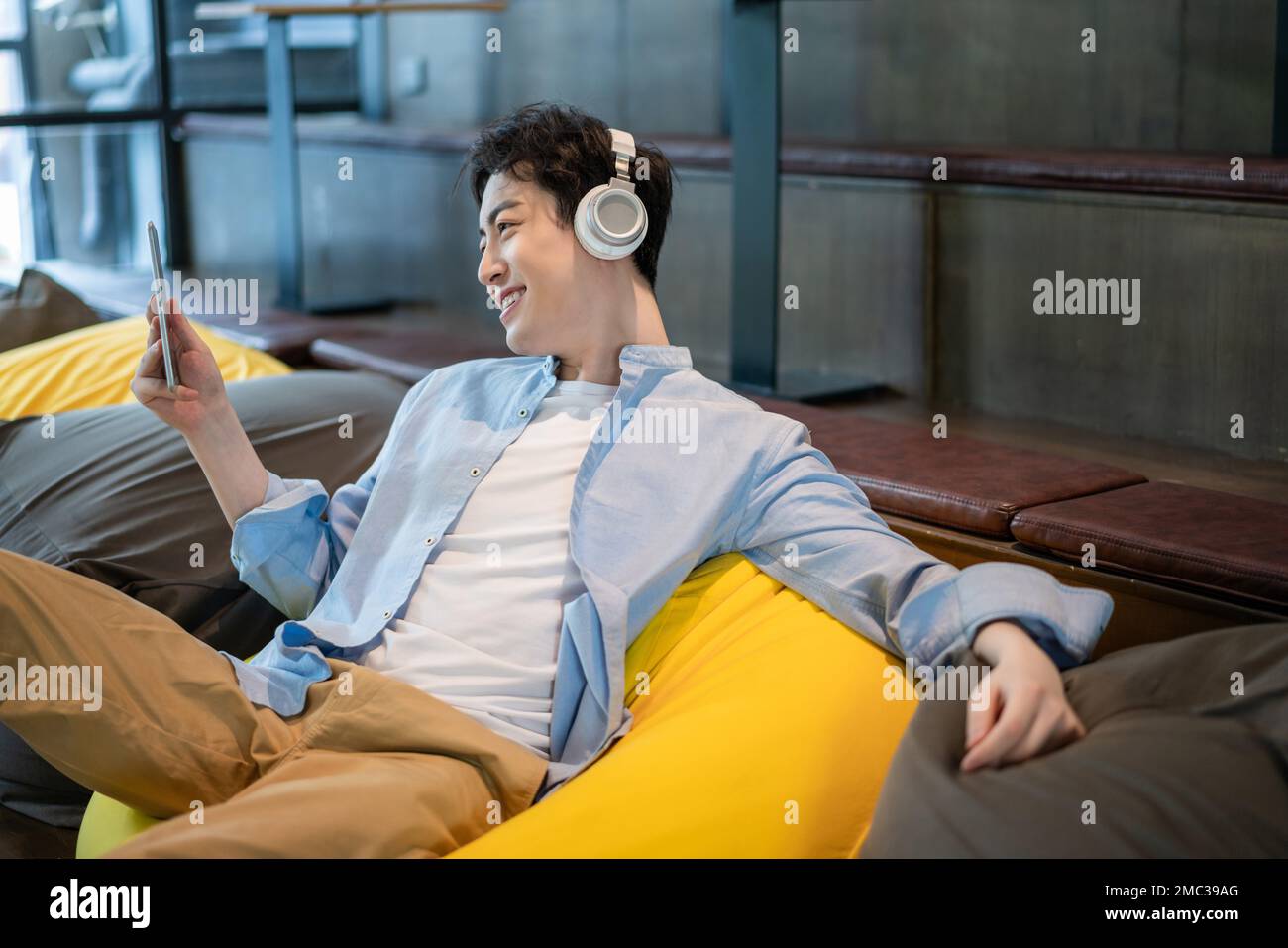 Carefree asian man listening music hi-res stock photography and images ...