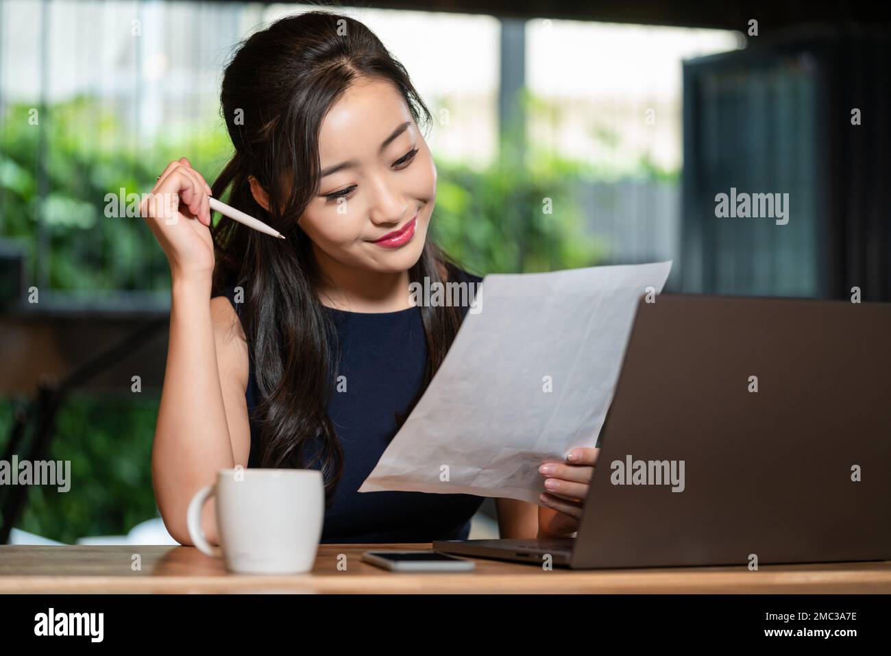 A young woman use the computer Stock Photo - Alamy