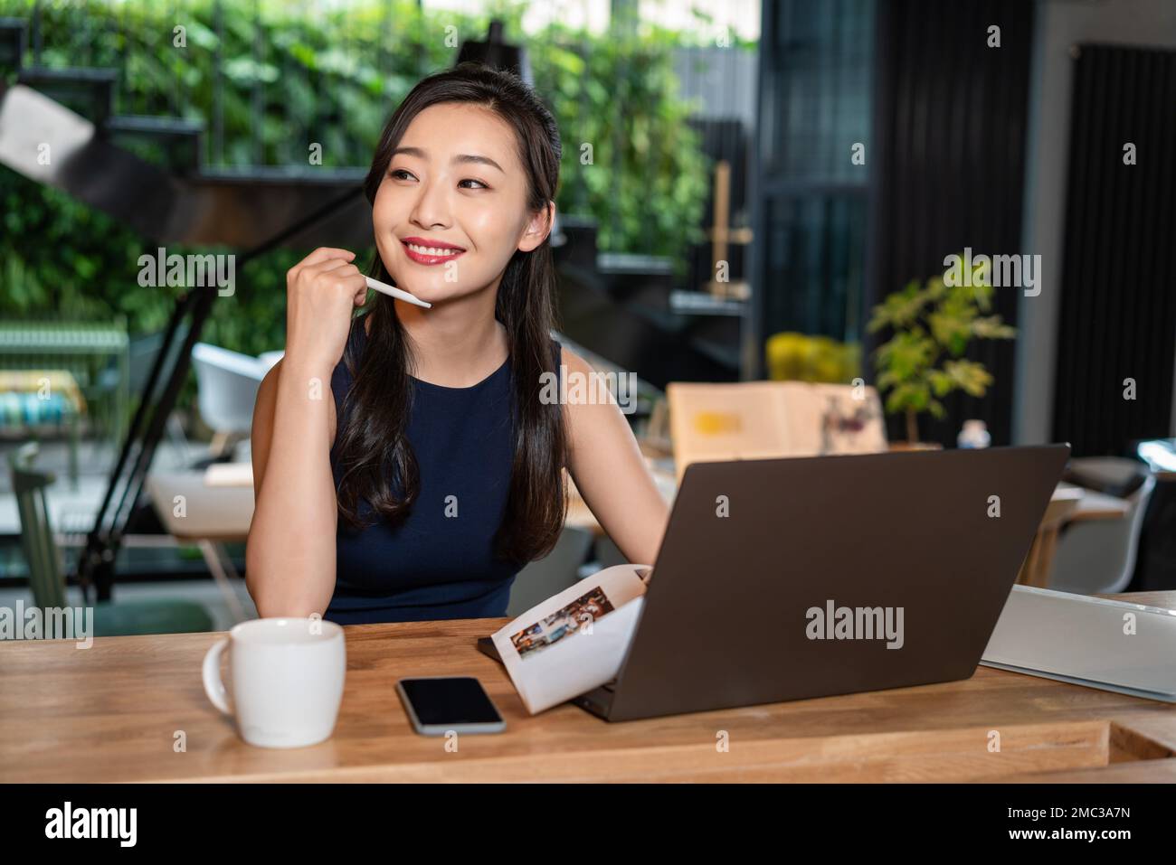 A young woman use the computer Stock Photo - Alamy