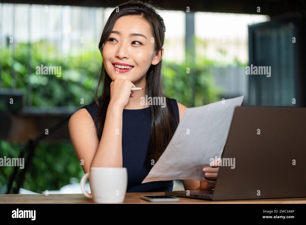 A young woman use the computer Stock Photo - Alamy