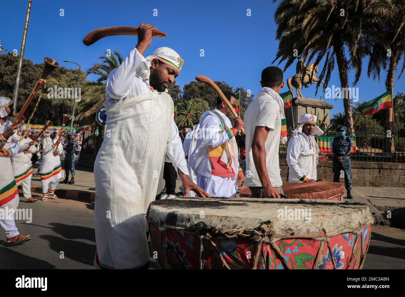 Ethiopians wearing traditional dress beat drums as they celebrate Adwa ...
