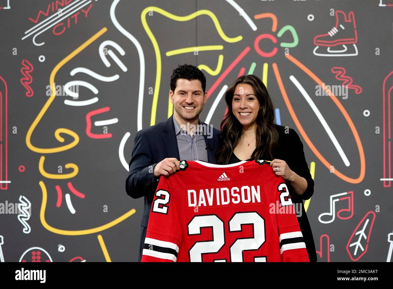Chicago Blackhawks General Manager Kyle Davidson poses with his wife ...
