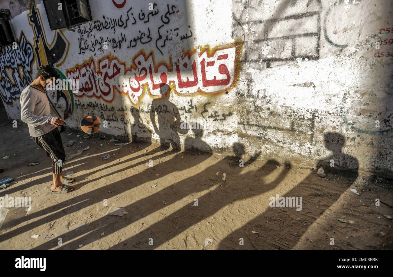 Gaza, Palestine. 21st Jan, 2023. A Palestinian child plays soccer in ...