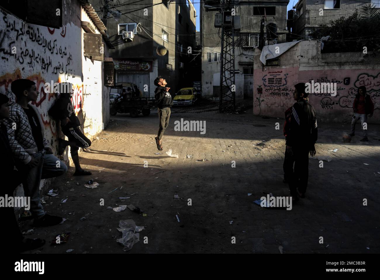 Gaza, Palestine. 21st Jan, 2023. Palestinian children playing football ...