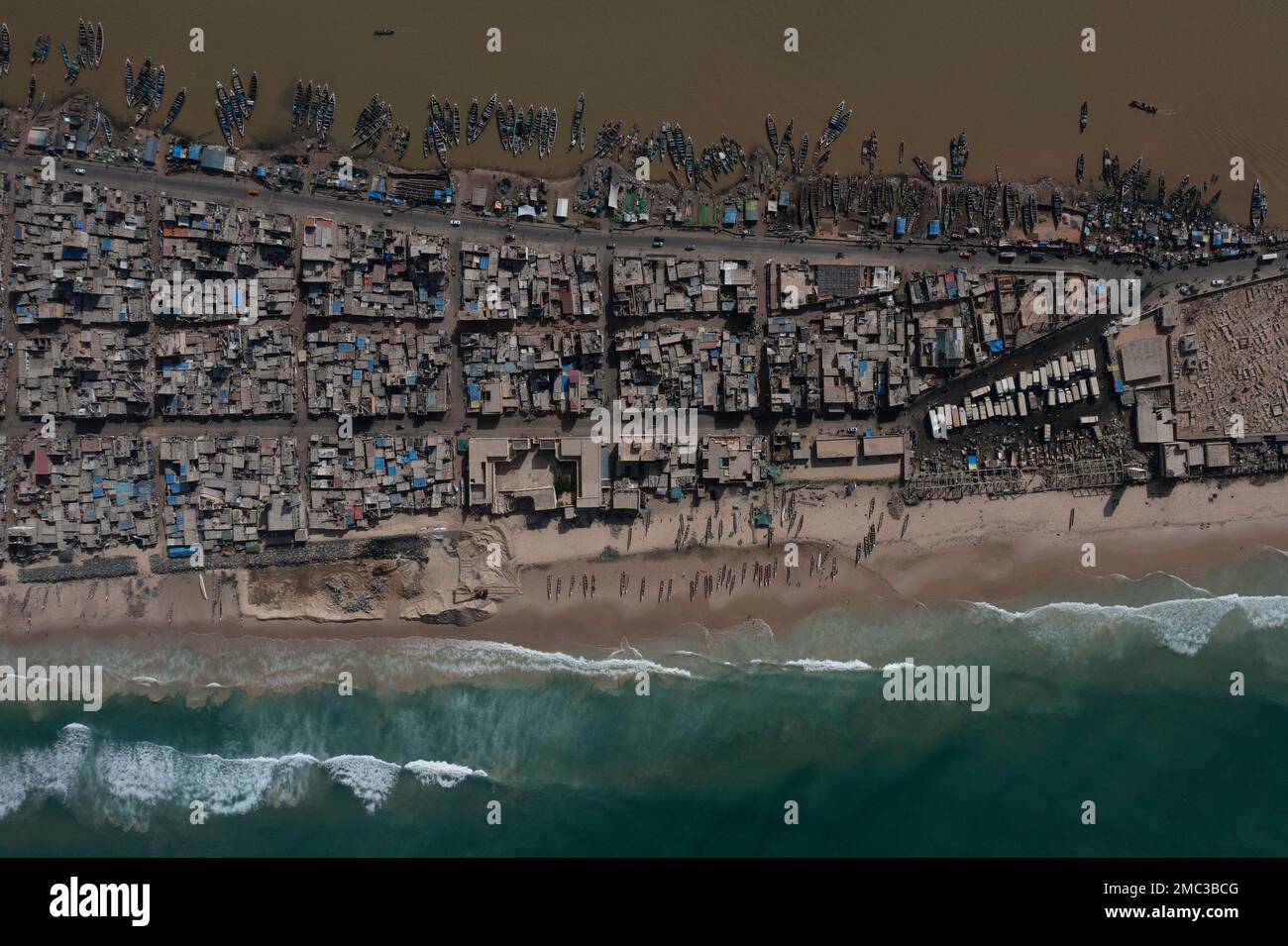 FILE - Houses lay between the Senegal river, top, and the Atlantic ...