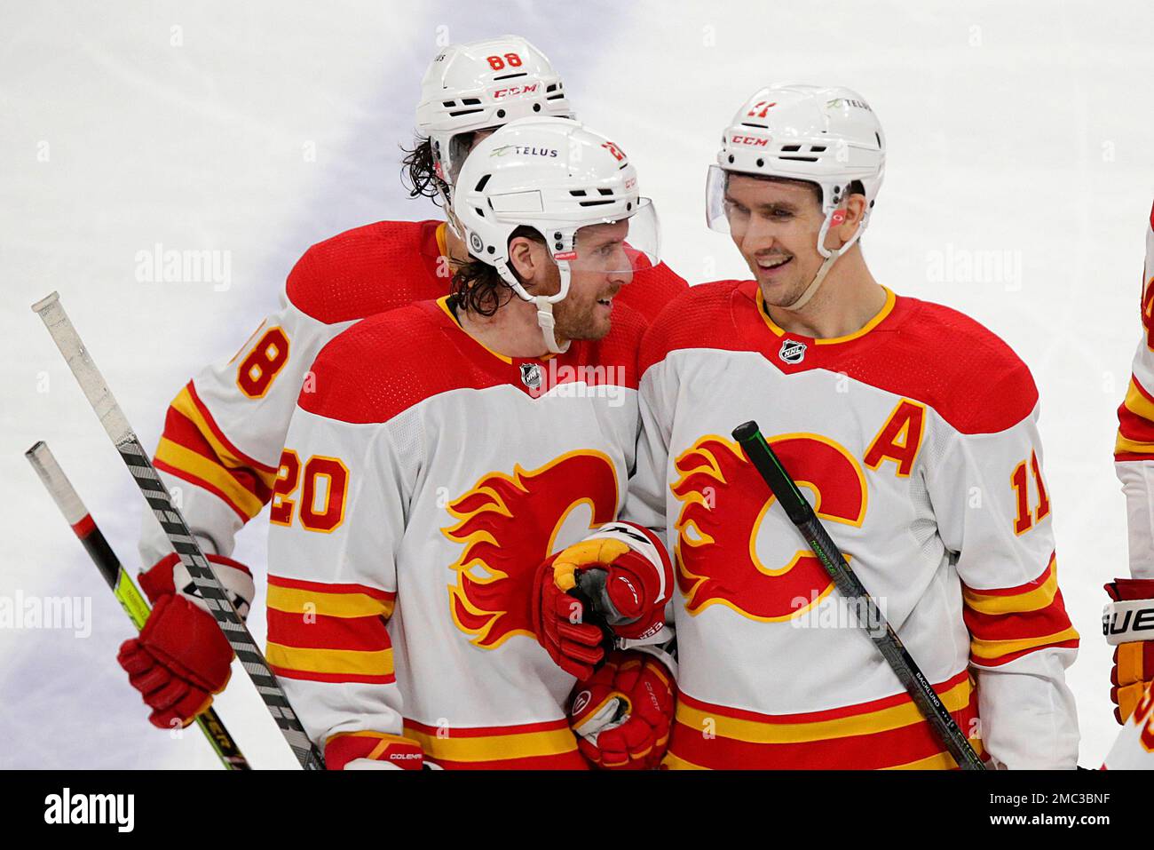 Calgary Flames center Mikael Backlund (11) receives congratulations ...