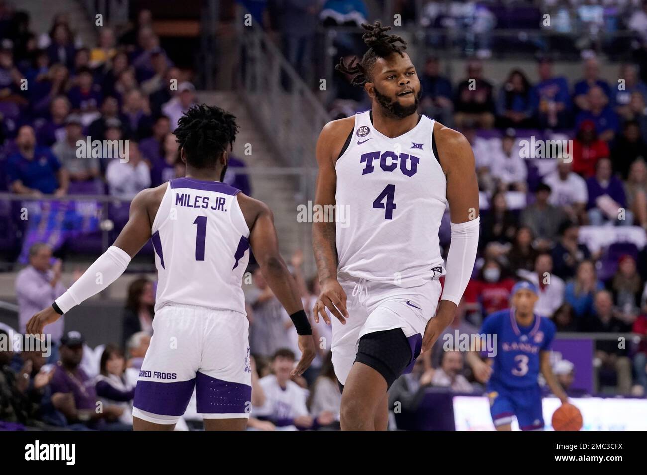 TCU 's Mike Miles (1) and Eddie Lampkin (4) celebrate after a basket ...