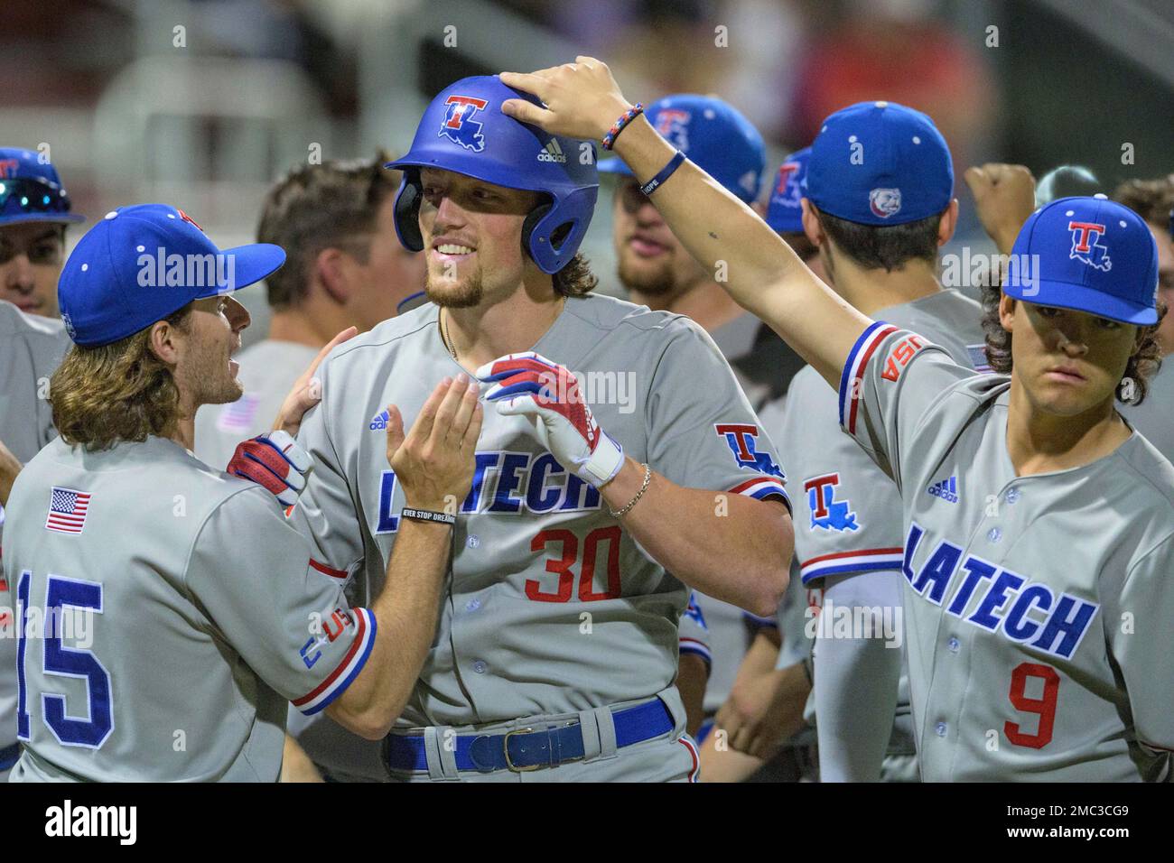 Louisiana Tech outfielder Steele Netterville (30) celebrates his three ...