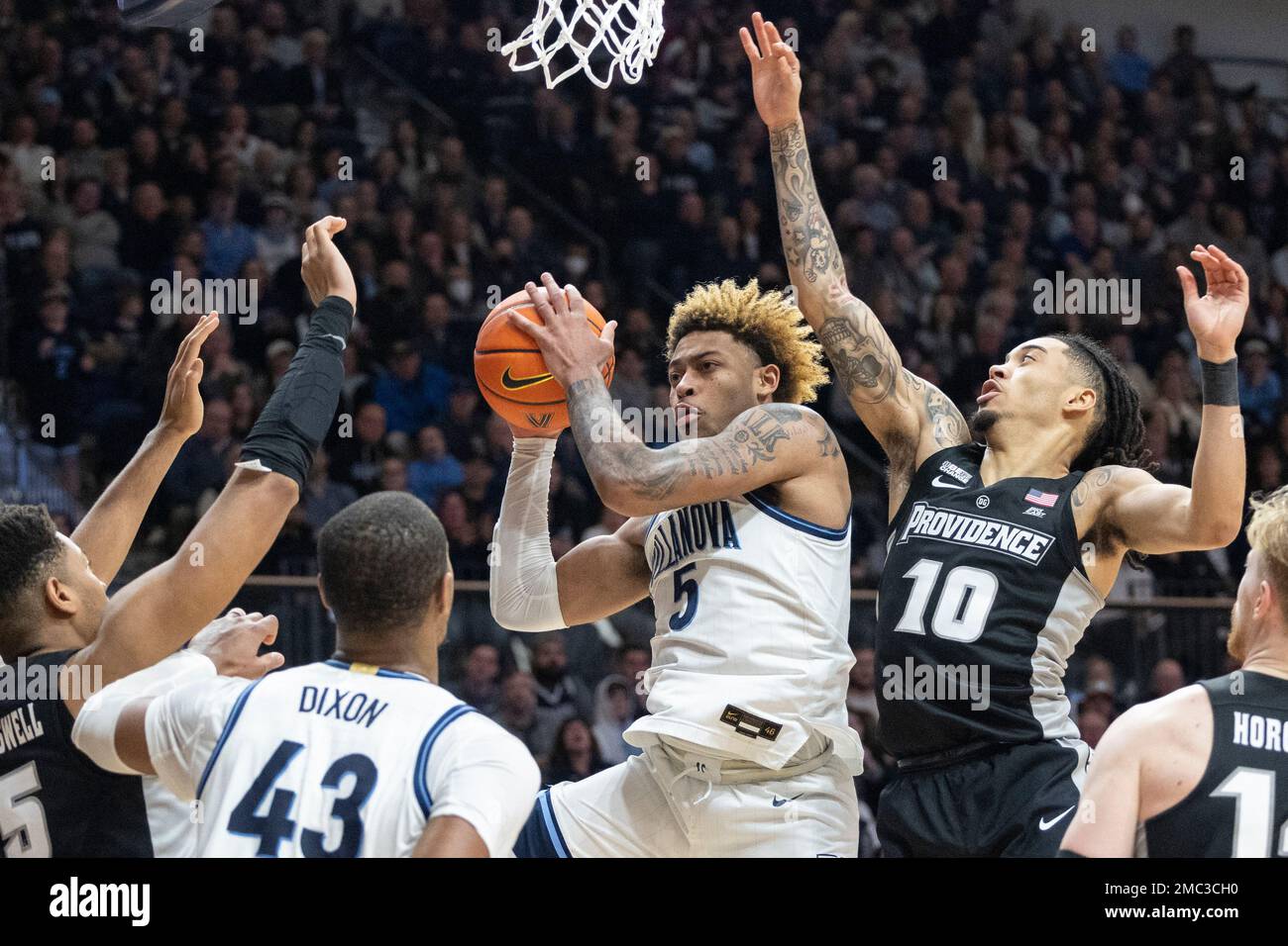 Villanova guard Justin Moore (5) grabs a rebound as Providence guard ...