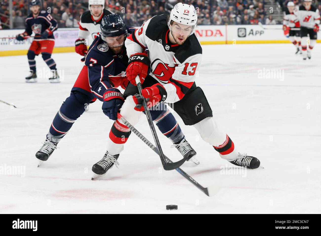 Columbus Blue Jackets' Sean Kuraly, left, and New Jersey Devils' Nico ...