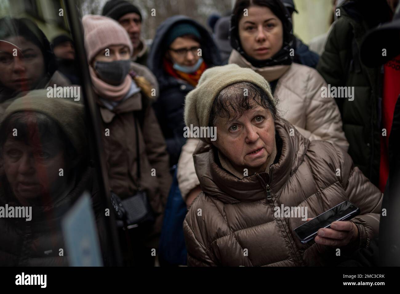 Ukrainians prepare to board a bus to Poland at Lviv bus main station ...