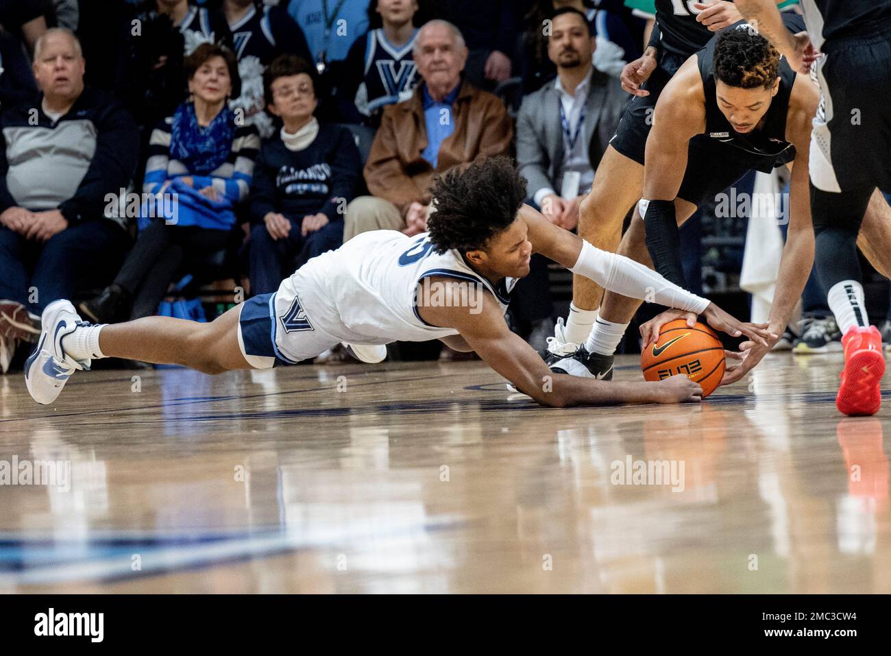 Villanova guard Jordan Longino, left, and Providence forward Ed ...