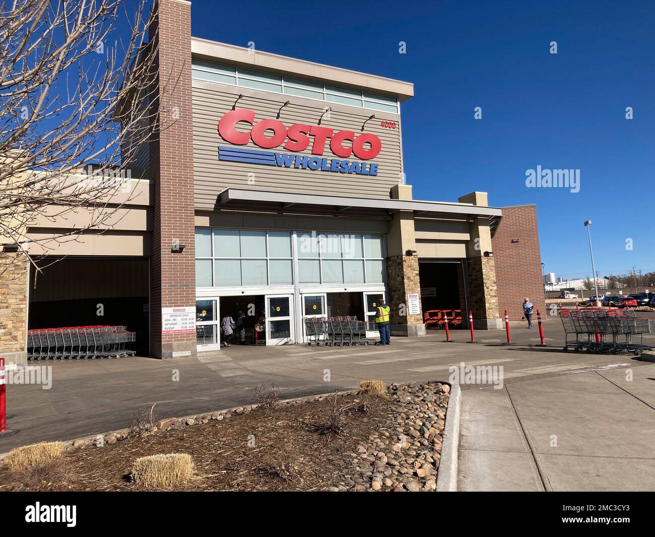 Shoppers head into a Costco warehouse store Tuesday, maerch 1, 2022, in ...