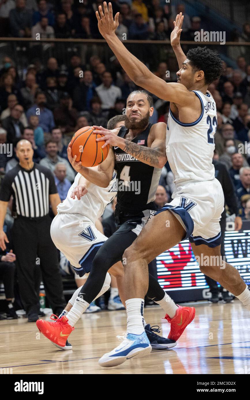 Providence guard Jared Bynum (4) moves past Villanova forward Jermaine ...