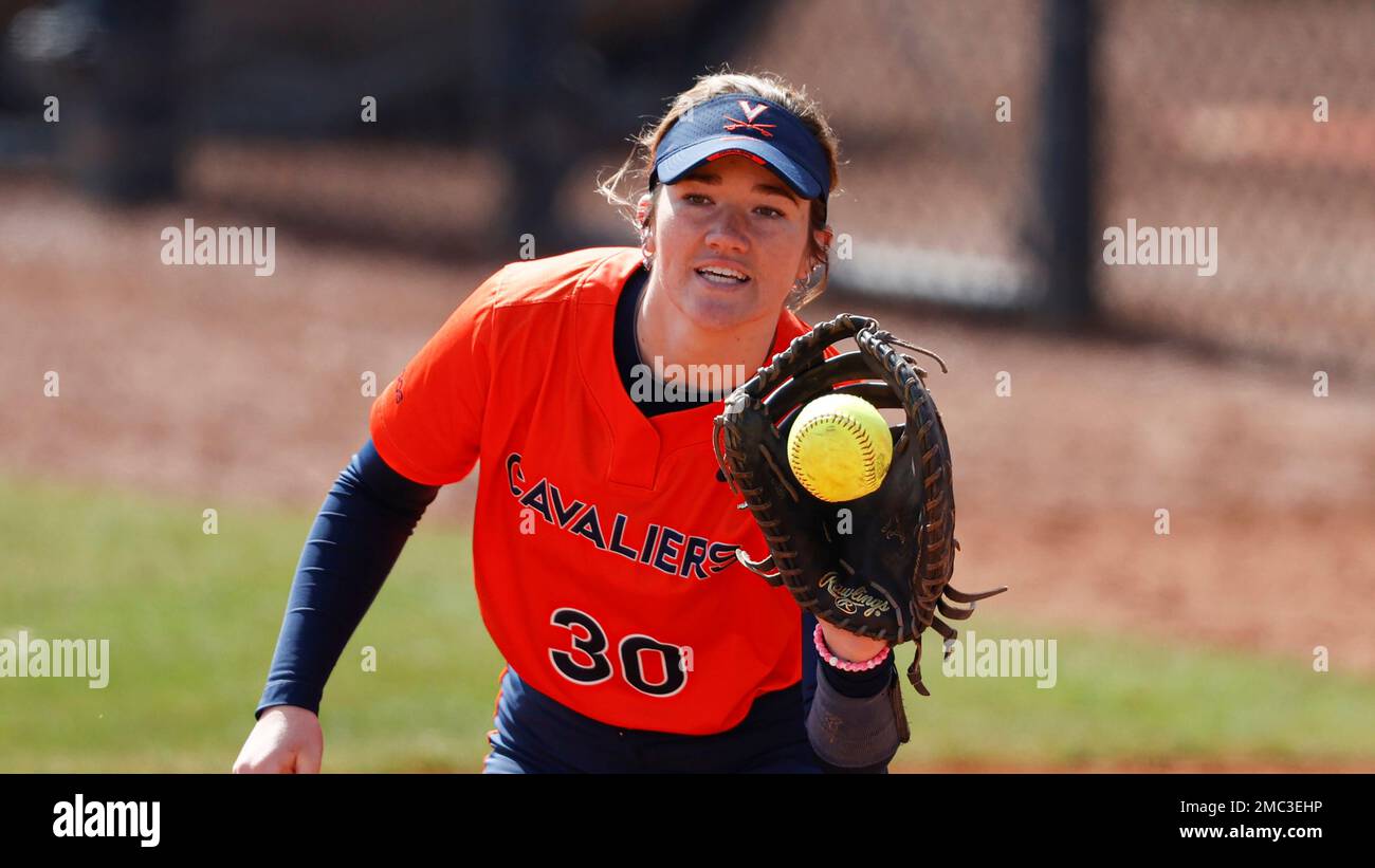 Virginia first baseman Gabby Baylog catches a throw for an out against ...