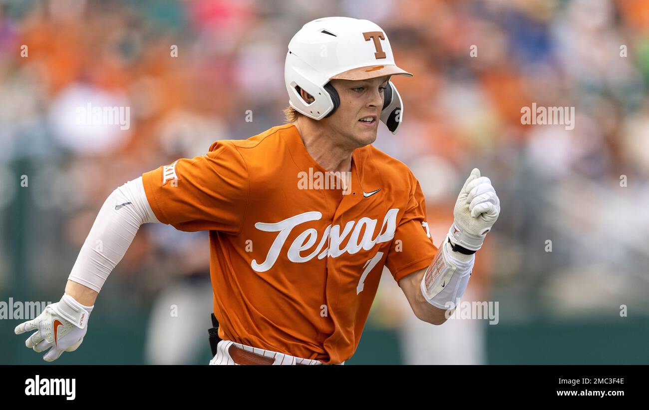 Texas outfielder Douglas Hodo scores against Rice during an NCAA ...