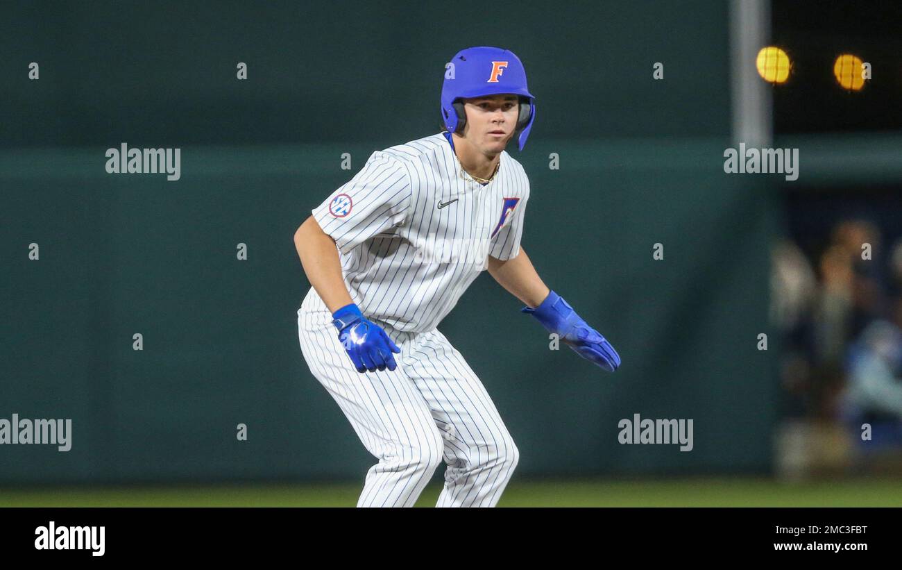 Florida outfielder Corey Robinson (1) leads off from first during an ...