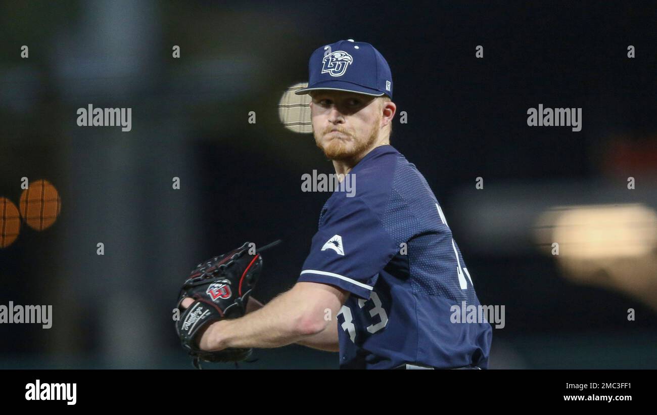 Liberty pitcher Cole Garrett (33) throws a pitch during an NCAA ...