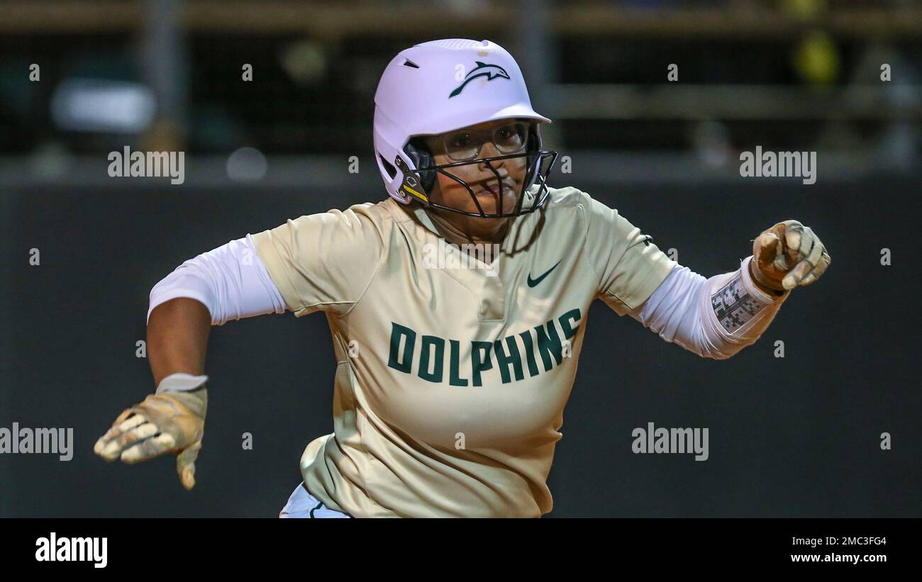 Jacksonville outfielder Chloe Lee (5) runs for first during an NCAA ...
