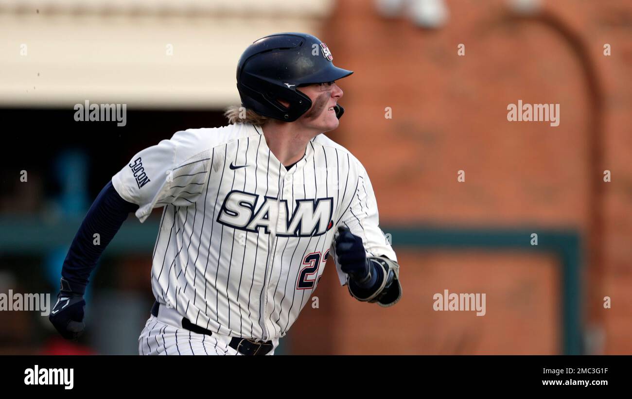 Samford outfielder Andrew Bennett (23) runs to first during an NCAA ...