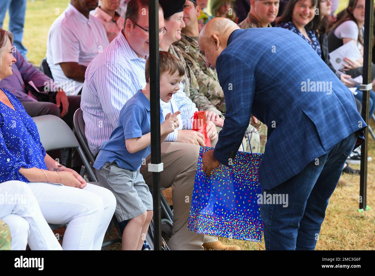 Benjamin Gerdelman seems quite excited to receive a departing gift from ...