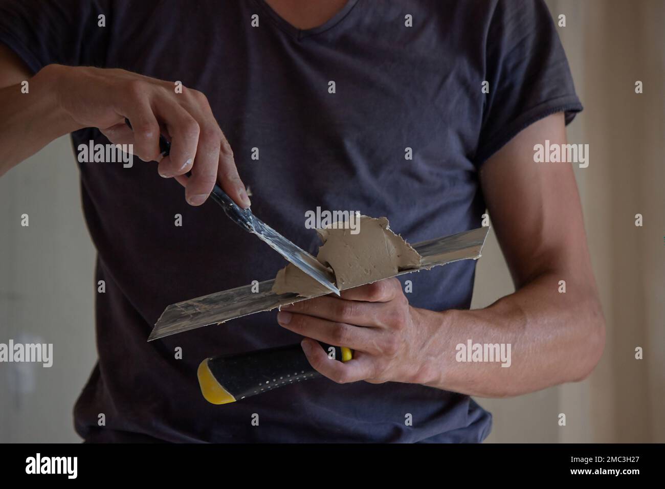 Professional painter smoothing white wall hi-res stock photography and ...