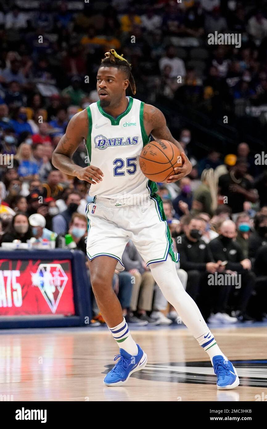 Dallas Mavericks forward Reggie Bullock handles the ball during an NBA ...