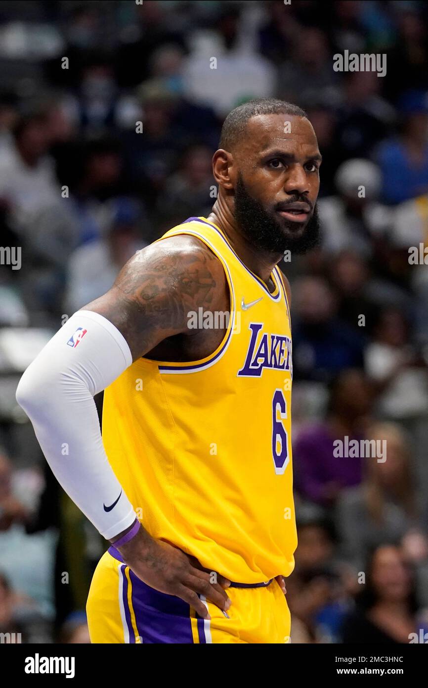 Los Angeles Lakers forward LeBron James watches an official, standing ...