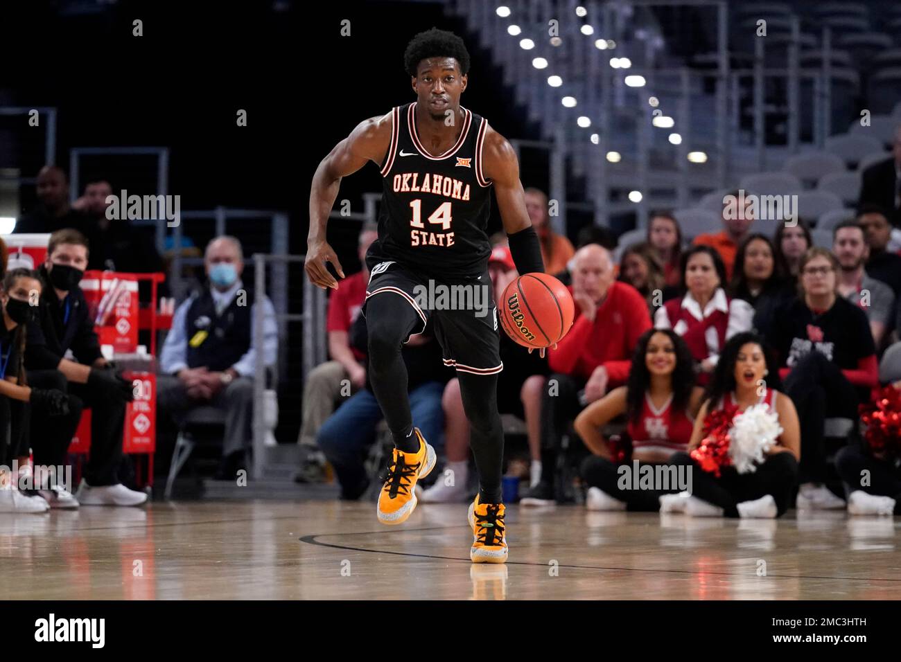 Oklahoma State guard Bryce Williams advances the ball up court during ...