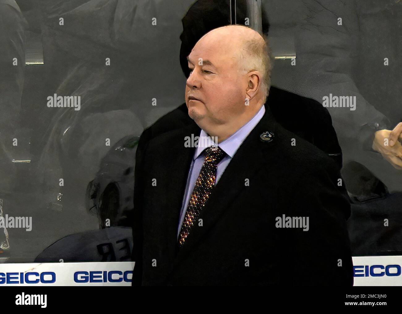 Vancouver Canucks coach Bruce Boudreau watches during the third period ...