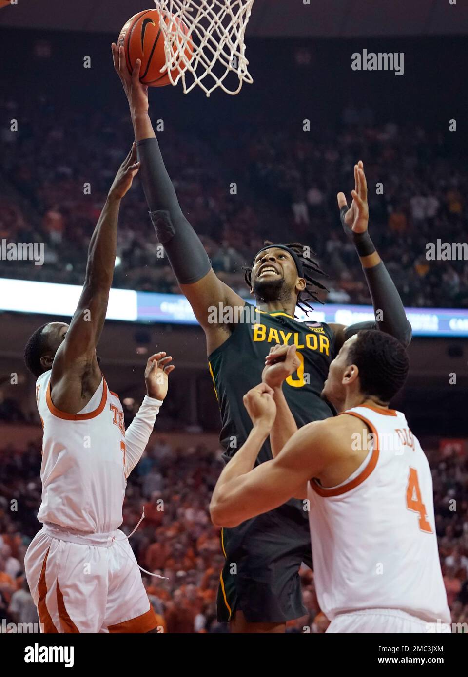 Baylor forward Flo Thamba (0) scores past Texas guard Courtney Ramey (3 ...
