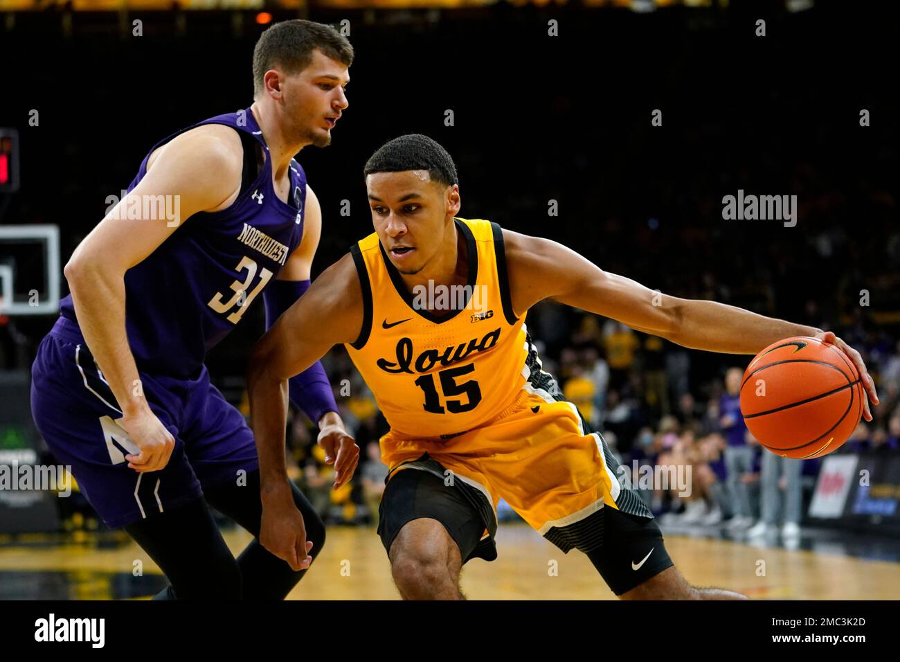 Iowa forward Keegan Murray (15) drives past Northwestern forward Robbie ...
