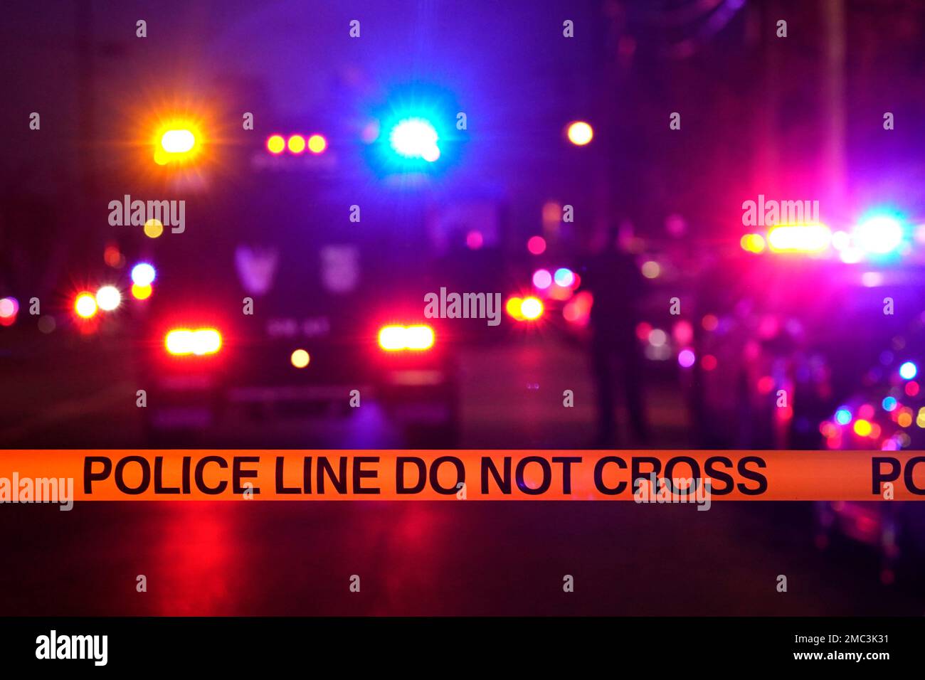 Police tape blocks the street near the scene of a shooting in ...