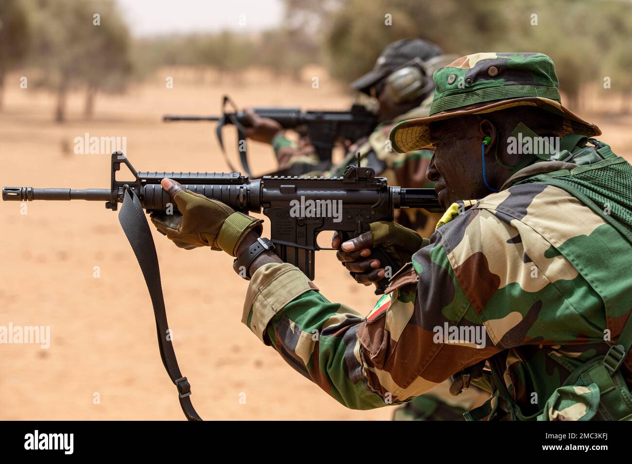 A Senegalese Armed Forces (SAF) soldier practices firing an M-4 carbine ...
