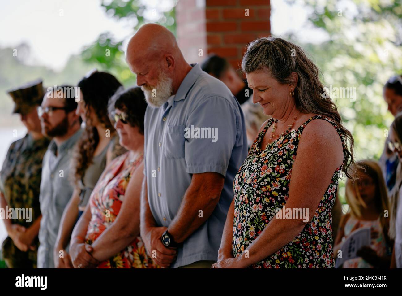 Lisa Castleberry prays during her retirement ceremony at Camp Lejeune ...