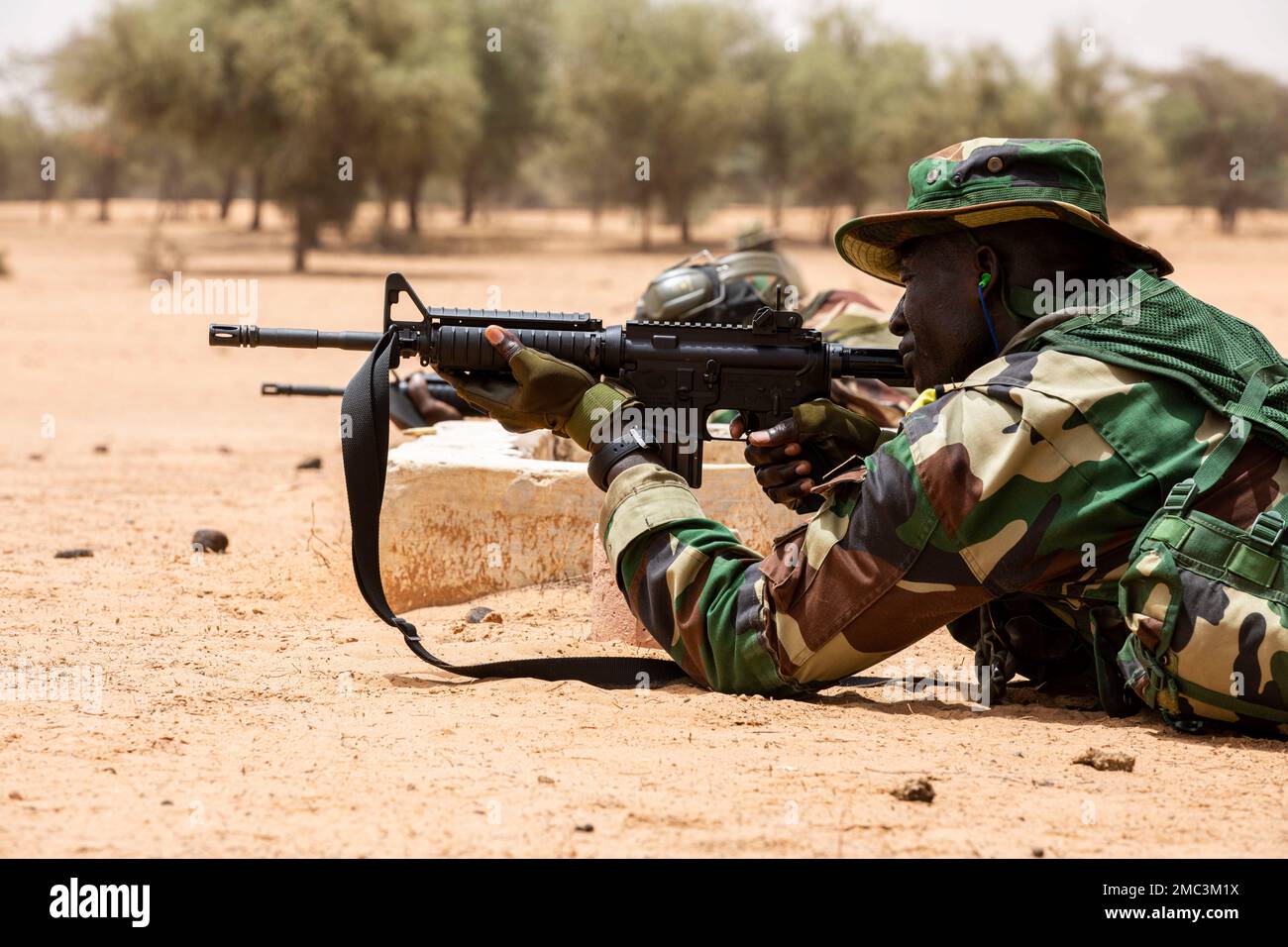 A Senegalese Armed Forces (SAF) soldier practices firing an M-4 carbine ...