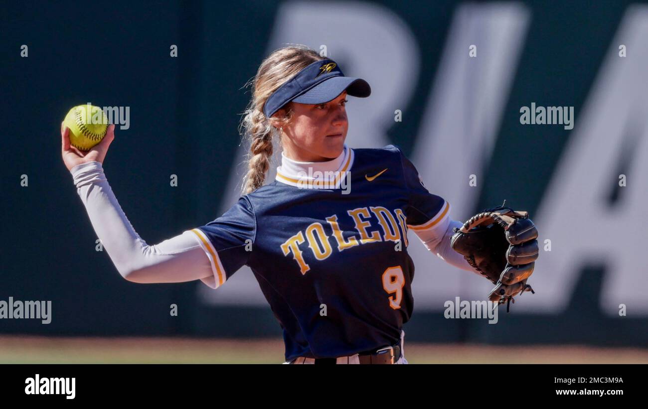 Toledo infielder Aleah Marra (9) throws to first during an NCAA ...
