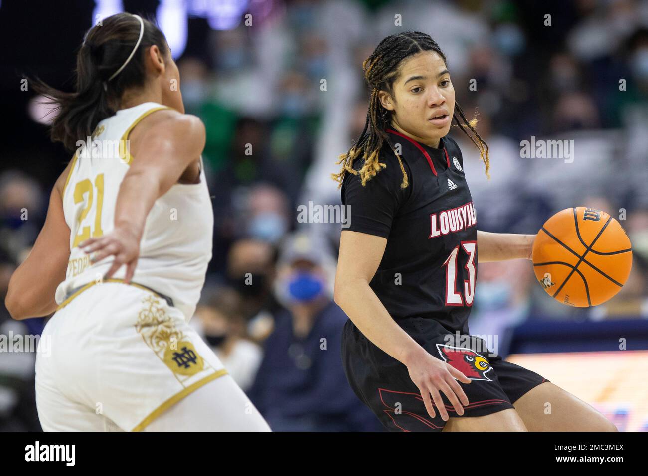 Louisville's Chelsie Hall (23) gets pressure from Notre Dame's Anaya ...