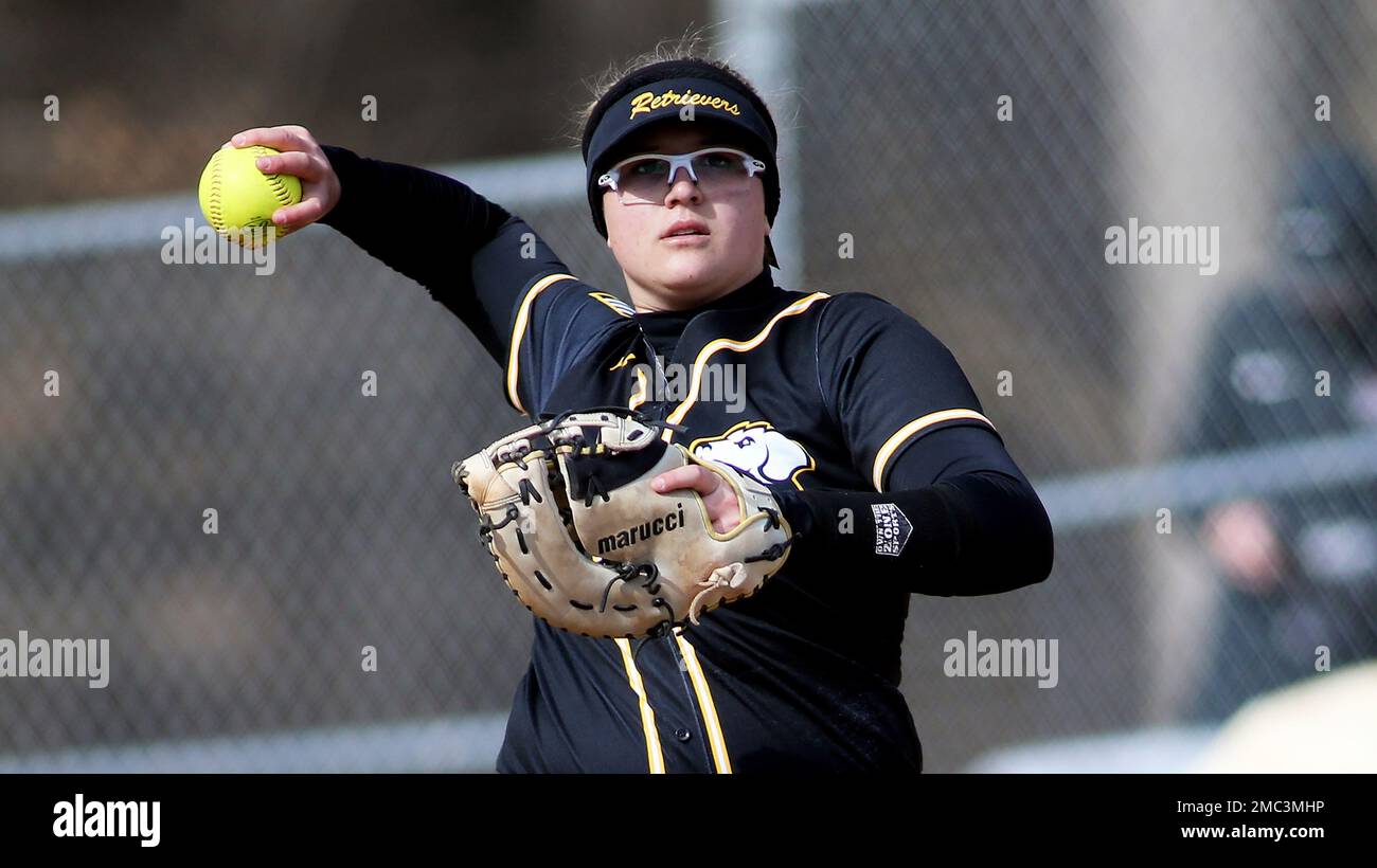UMBC infielder Madison Wilson (24) throws during an NCAA softball game ...