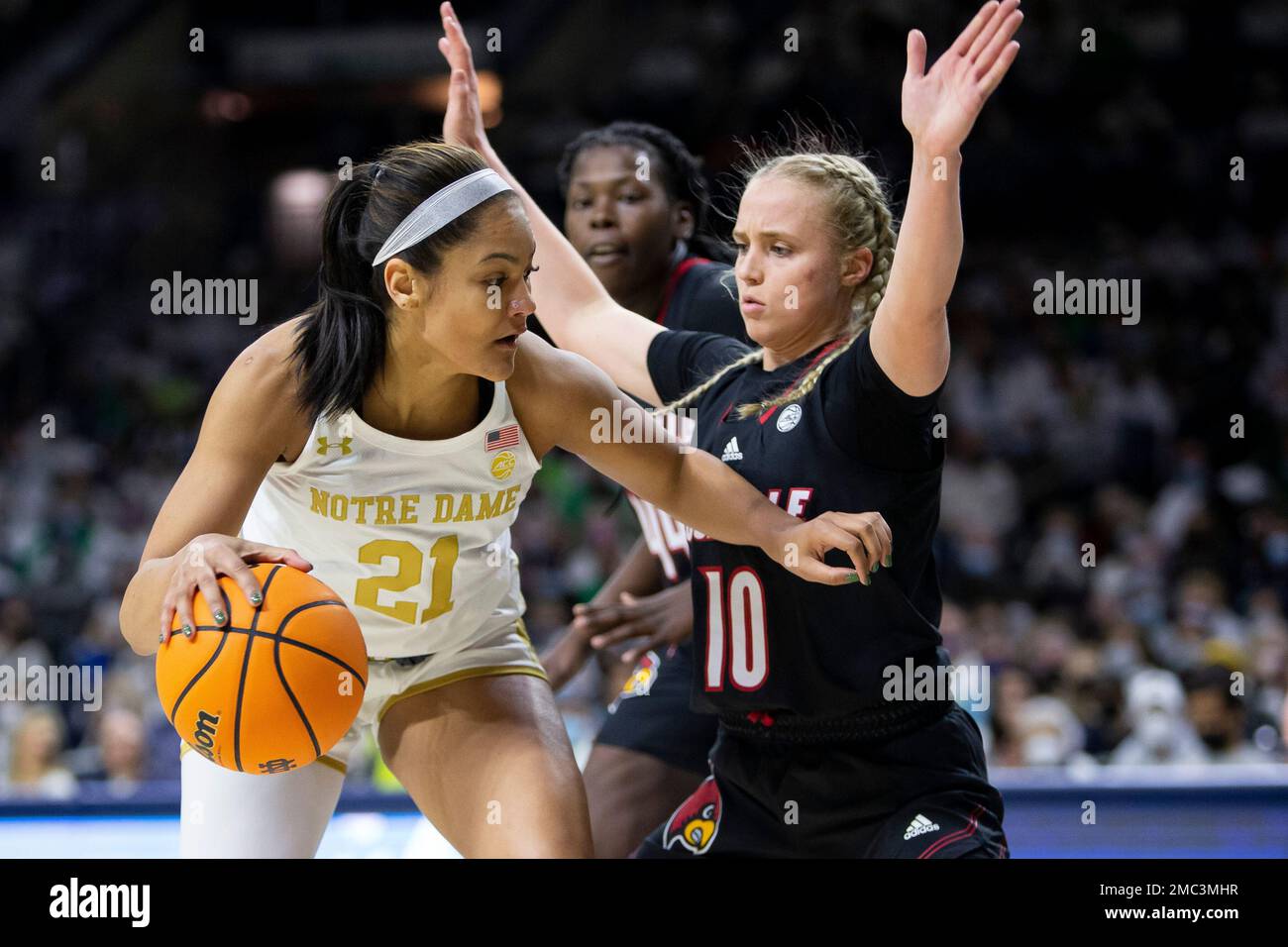 Notre Dame's Anaya Peoples (21) gets pressure from Louisville's Hailey ...
