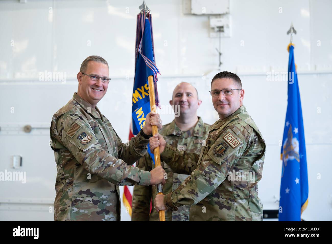 Maj. Daniel Foster, right, accepts command of the 341st Missile ...